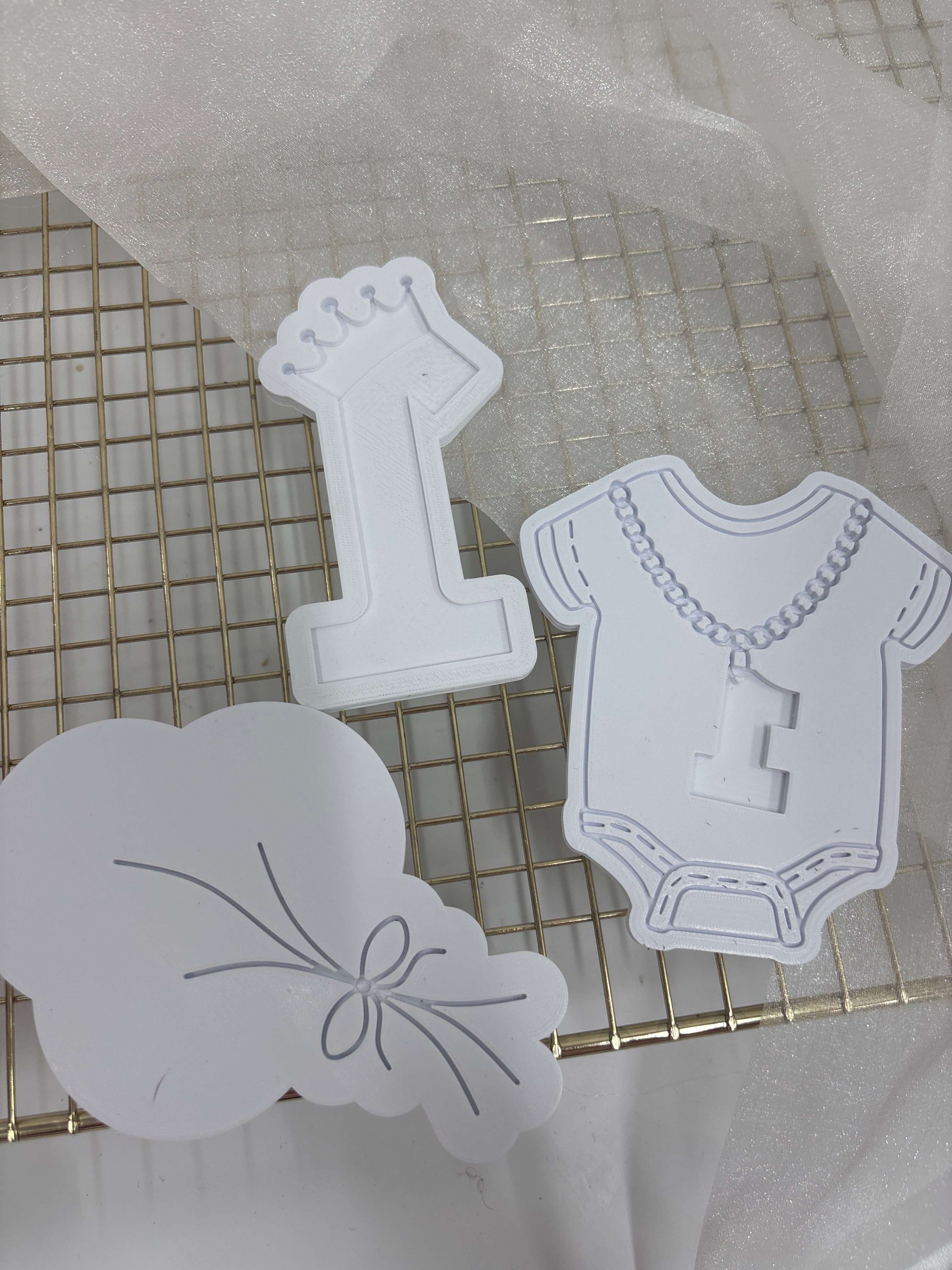 Odd Bunch- blank balloon string, one with crown & onesie with chain ...